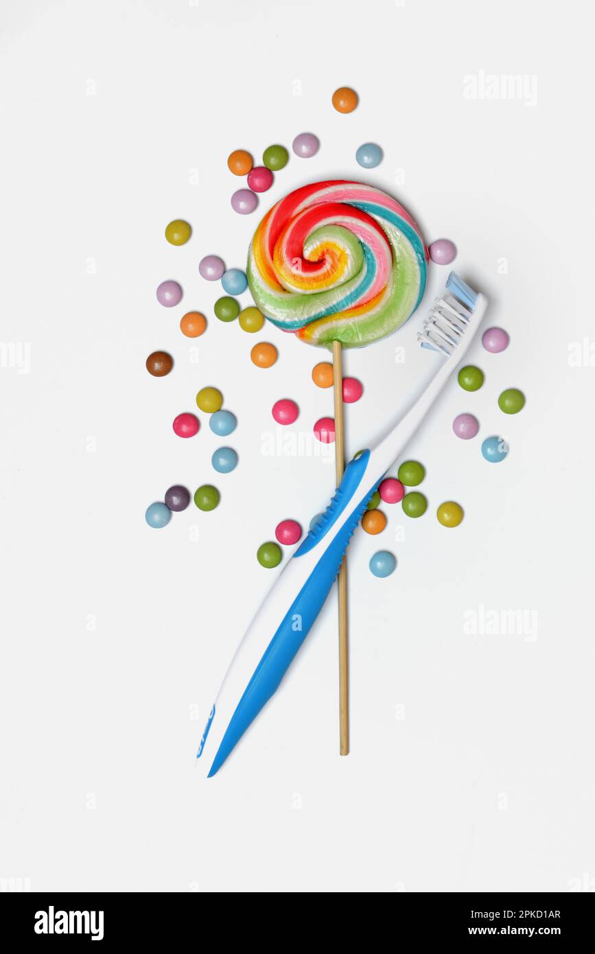 Candy canes, lollipops and toothbrush, dental hygiene Stock Photo - Alamy