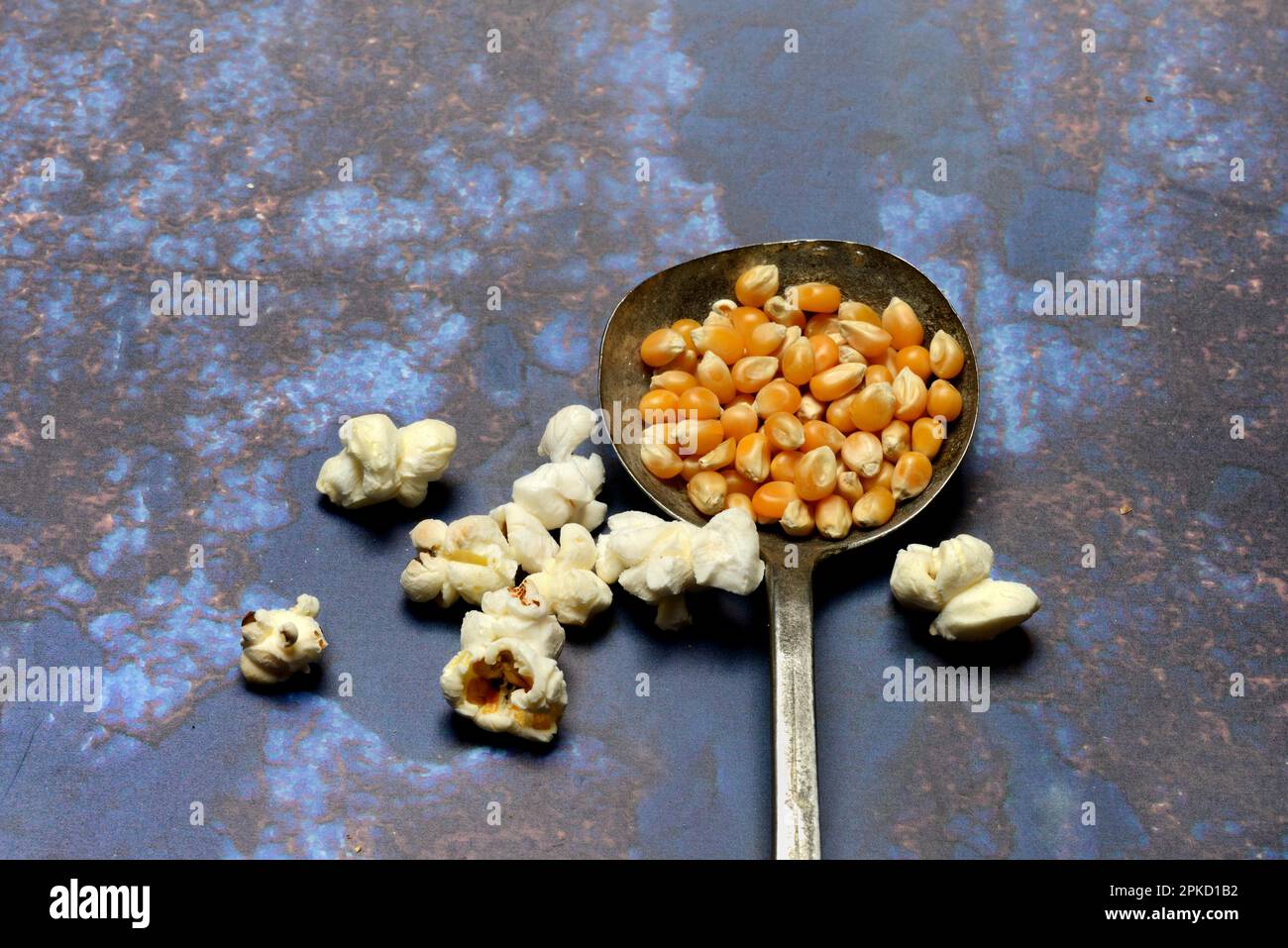 Corn (Zea mays) kernels in ladle and popcorn, puffed corn Stock Photo ...