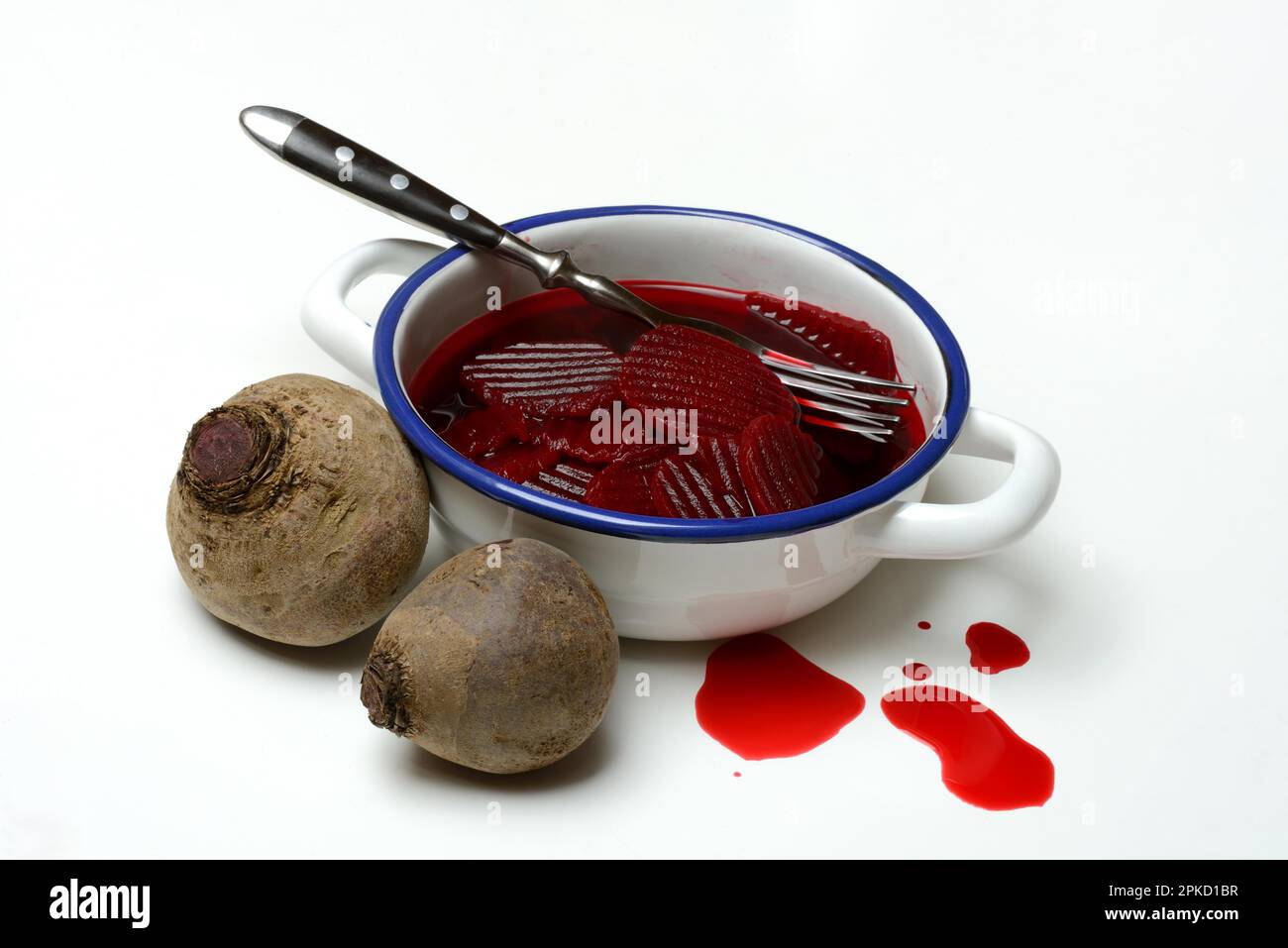 Sliced pickled beetroot with peel and fork, Beta vulgaris Stock Photo ...