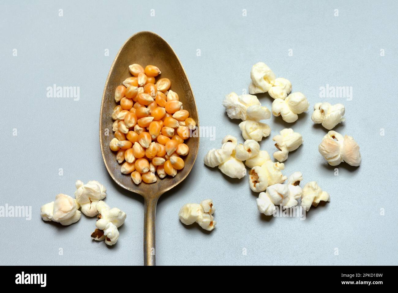 Corn (Zea mays) kernels in spoon and popcorn, puffed corn Stock Photo ...