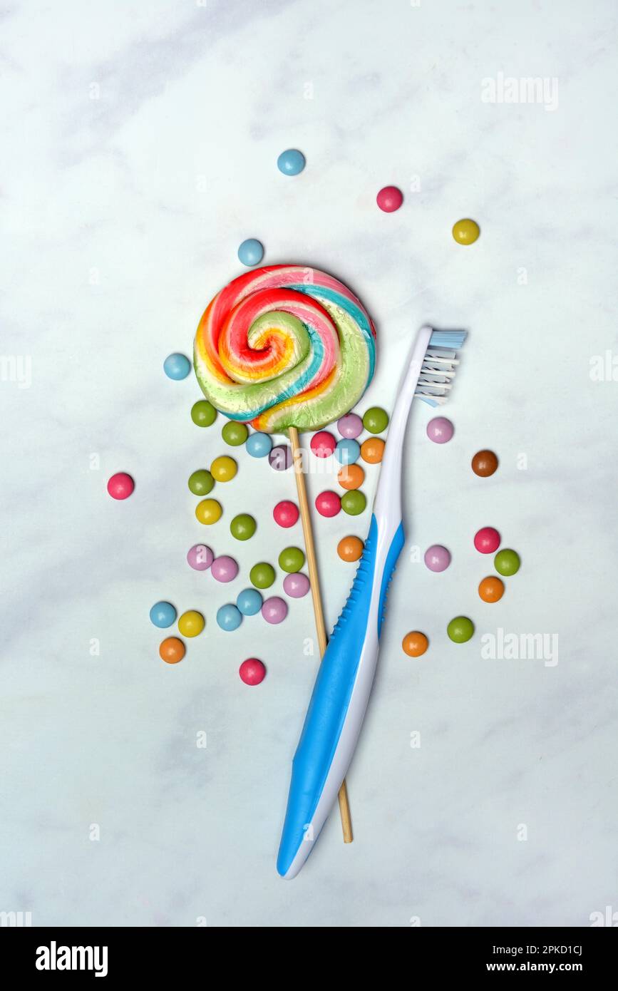 Candy canes, lollipops and toothbrush, dental hygiene Stock Photo - Alamy