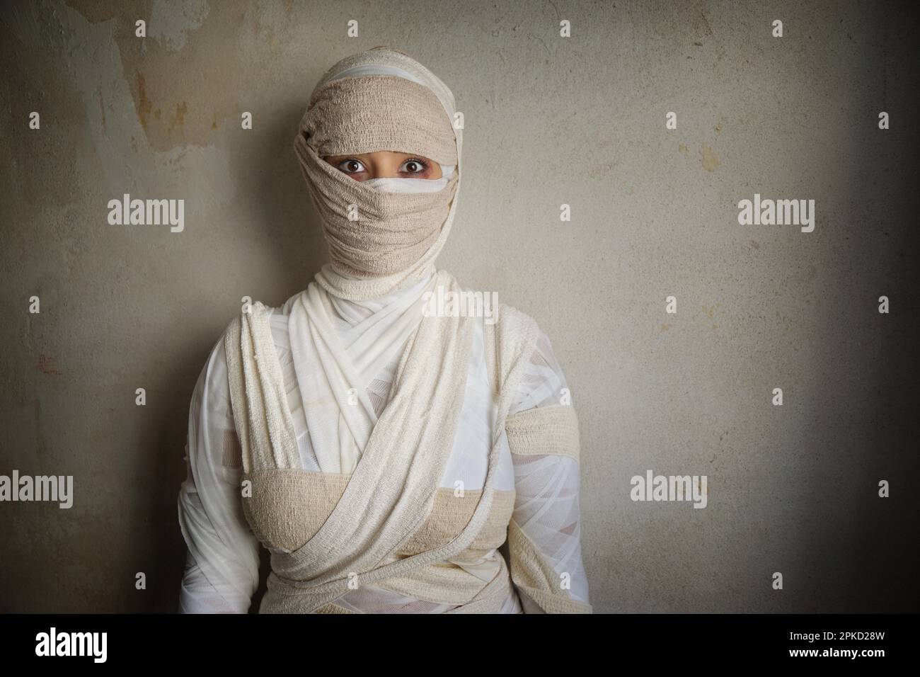 woman wrapped in bandages as egyptian mummy halloween costume Stock ...