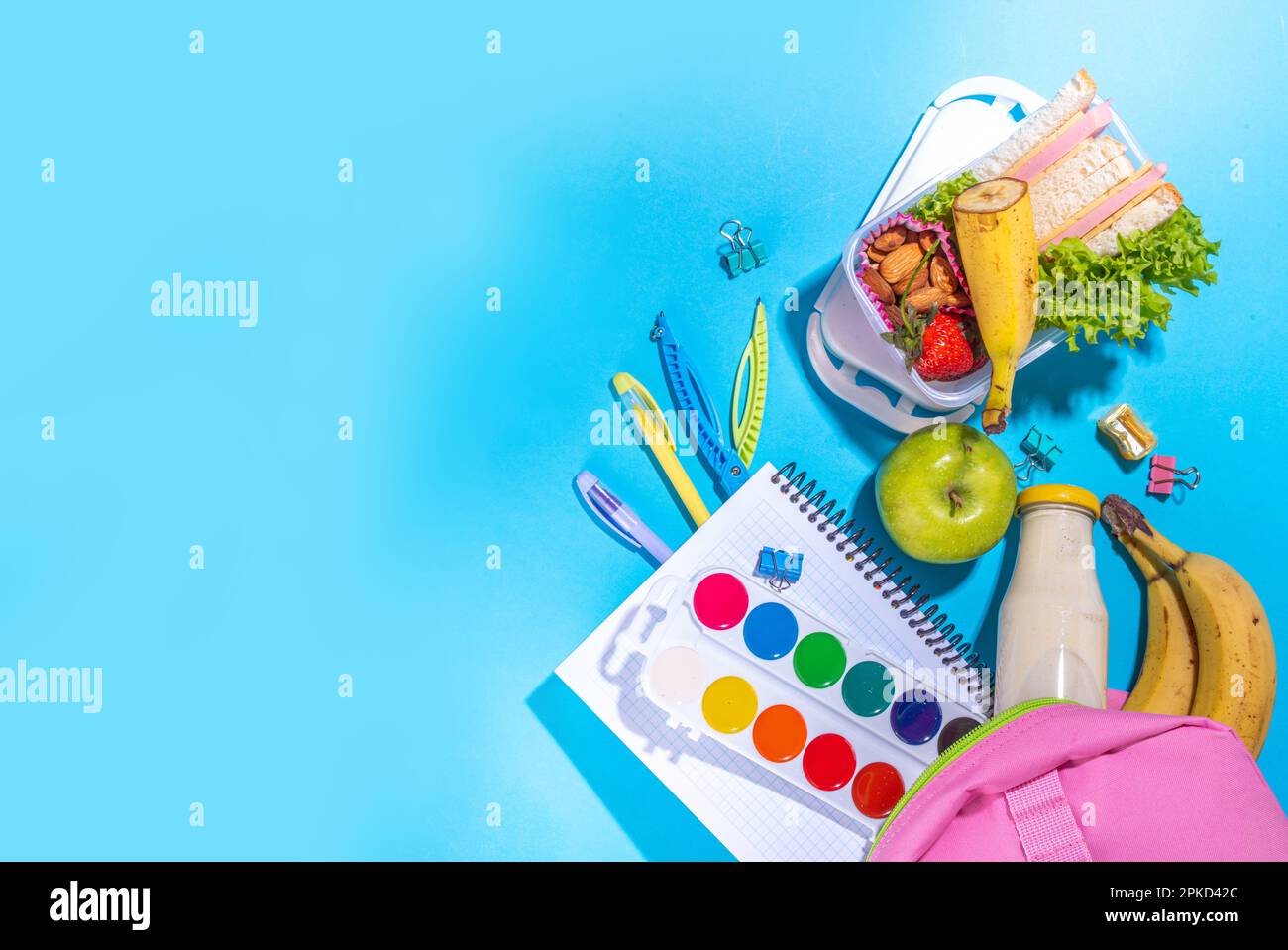 Healthy school lunch box: sandwich, vegetables, fruit, nuts and yogurt ...