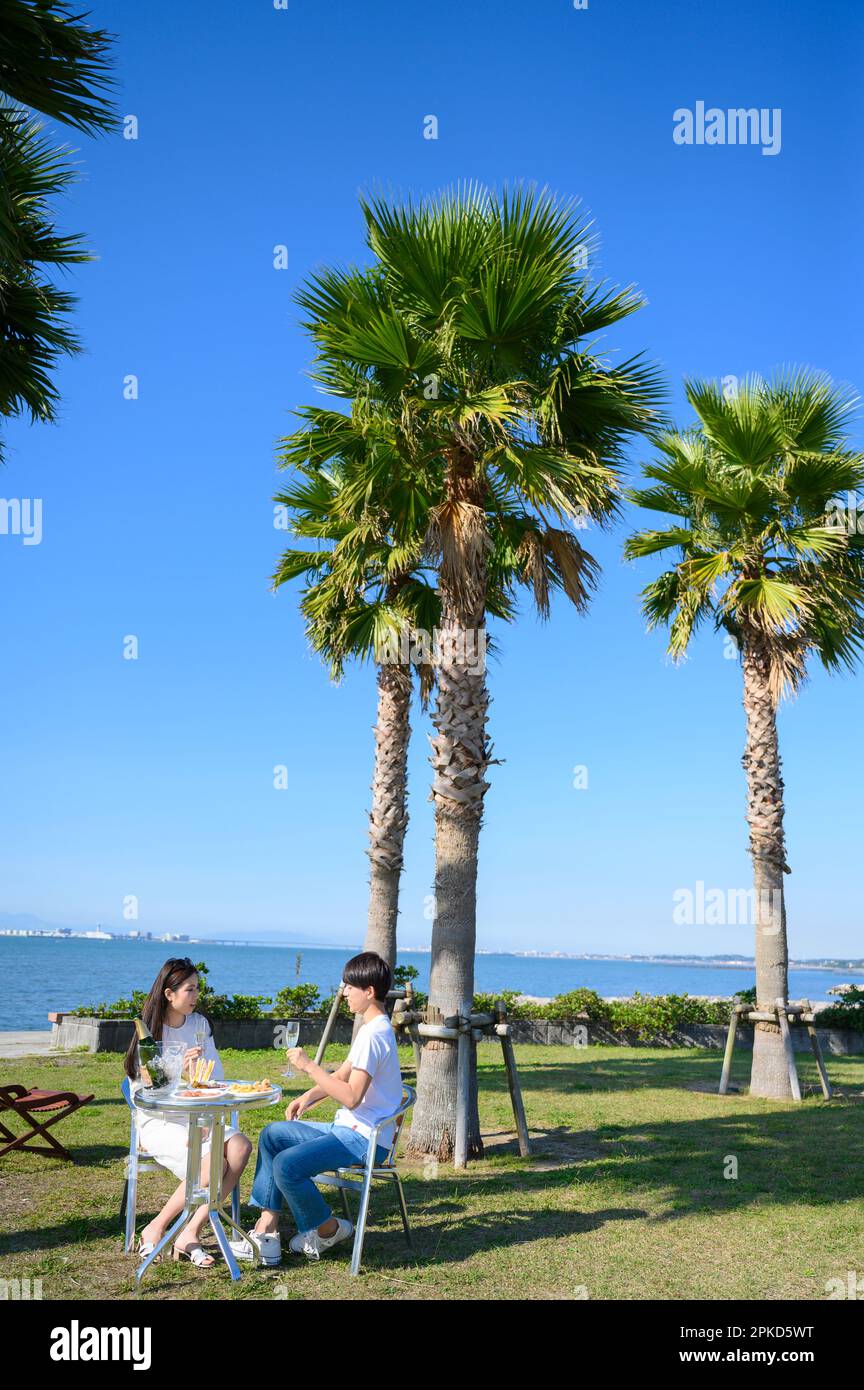 Couple dining in a sea resort Stock Photo - Alamy