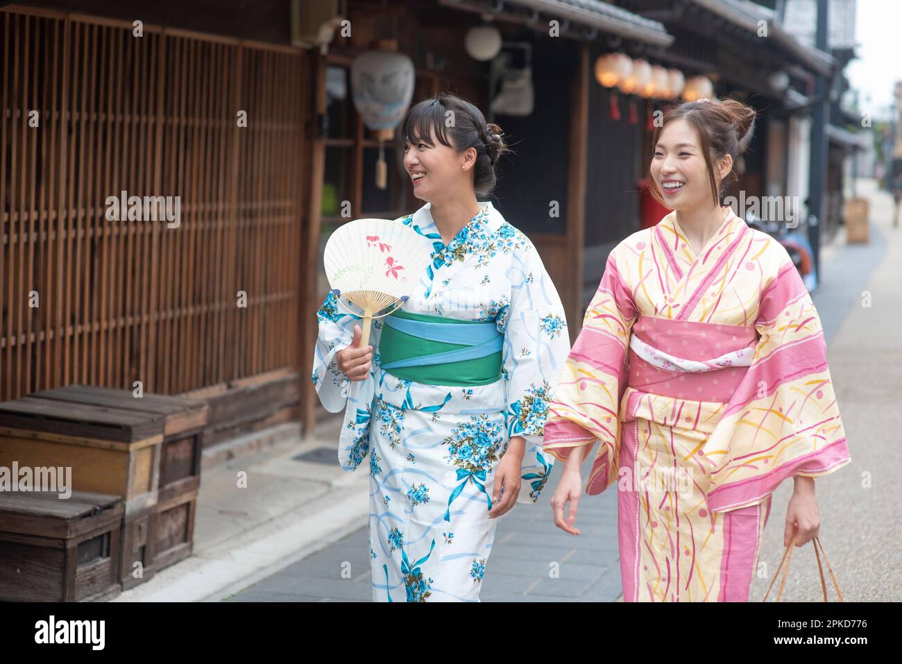 Two women in yukata strolling in an old private house Stock Photo - Alamy