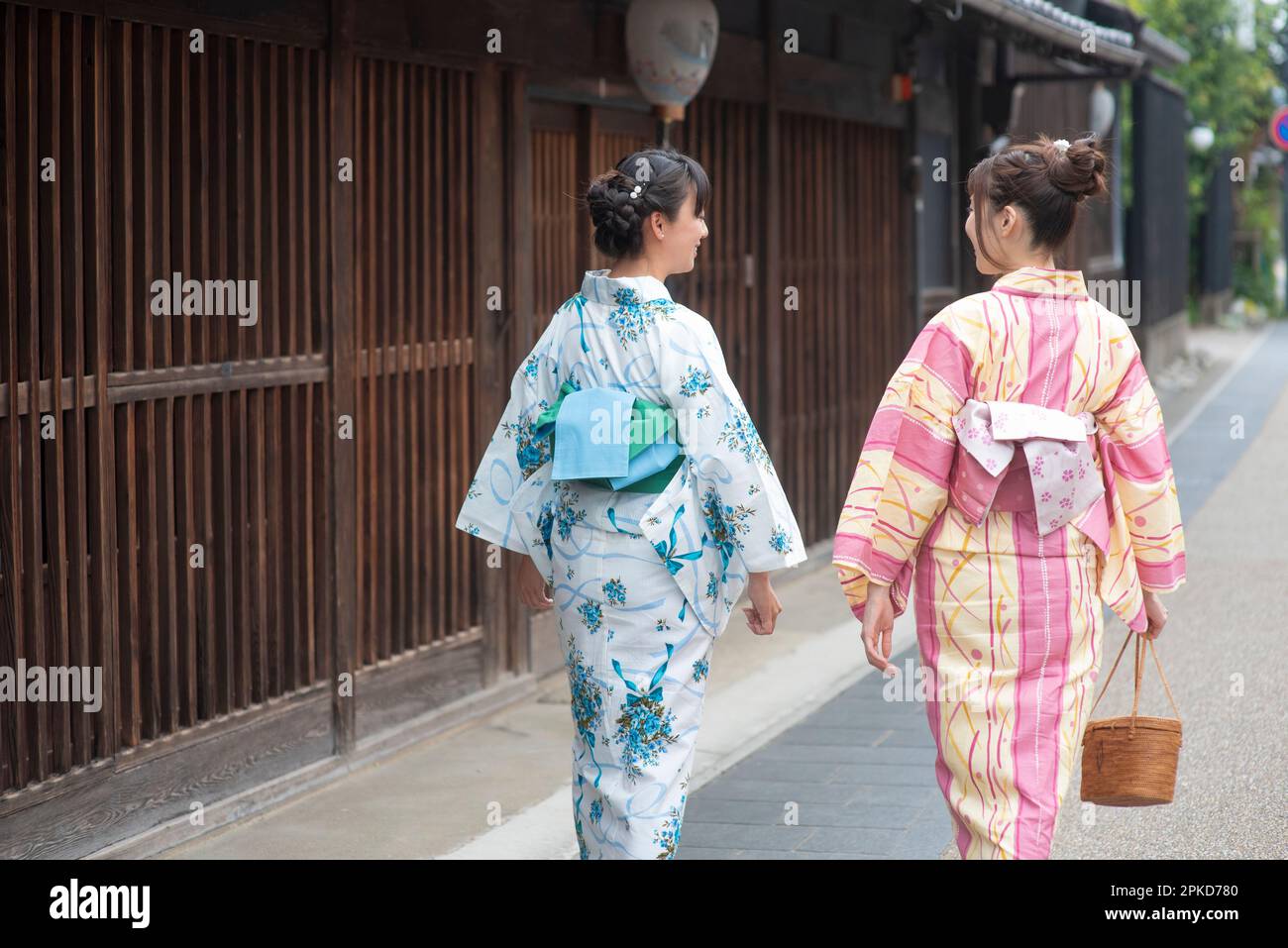 Two women in yukata strolling in an old private house Stock Photo - Alamy