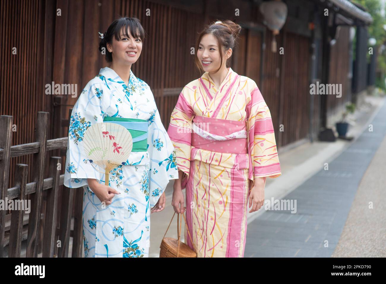 Two women in yukata strolling in an old private house Stock Photo - Alamy