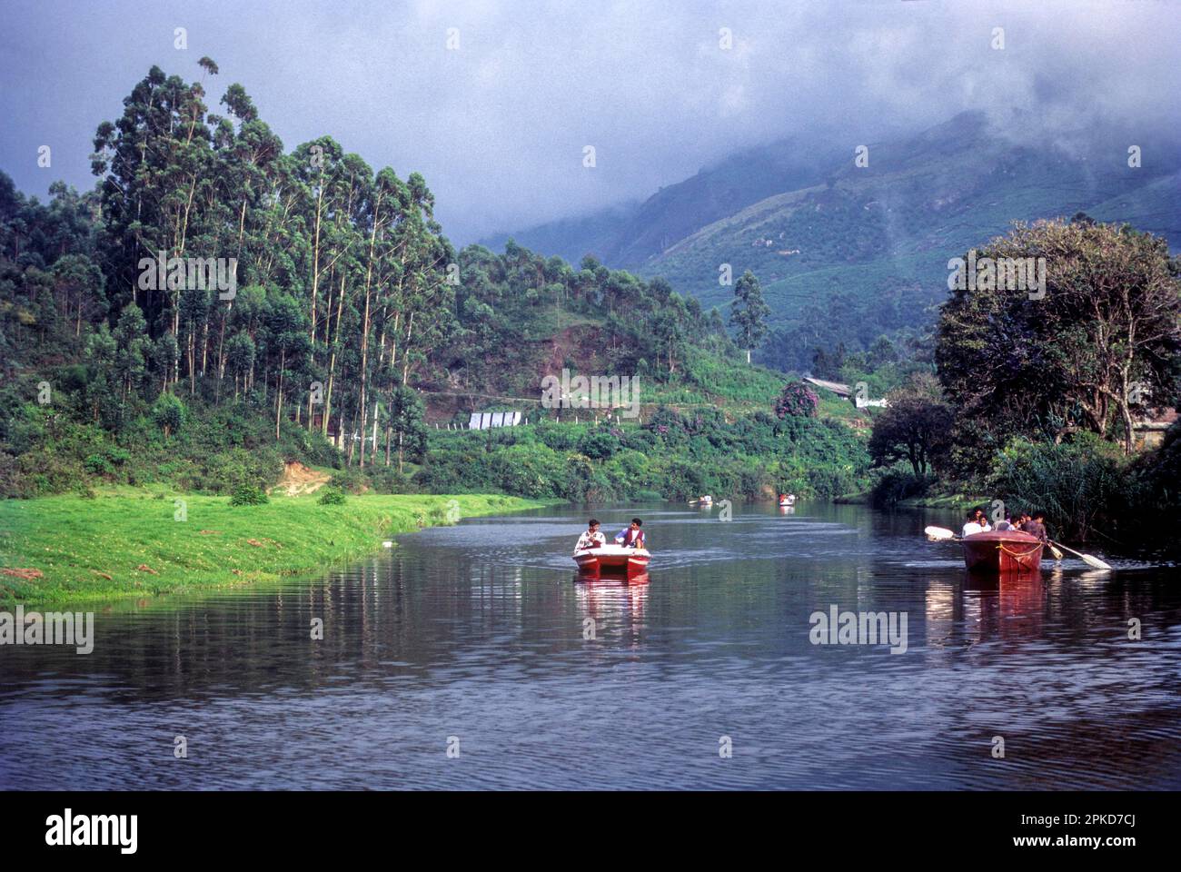 Boating on the lake in Munnar hill resort situated at the confluence of ...