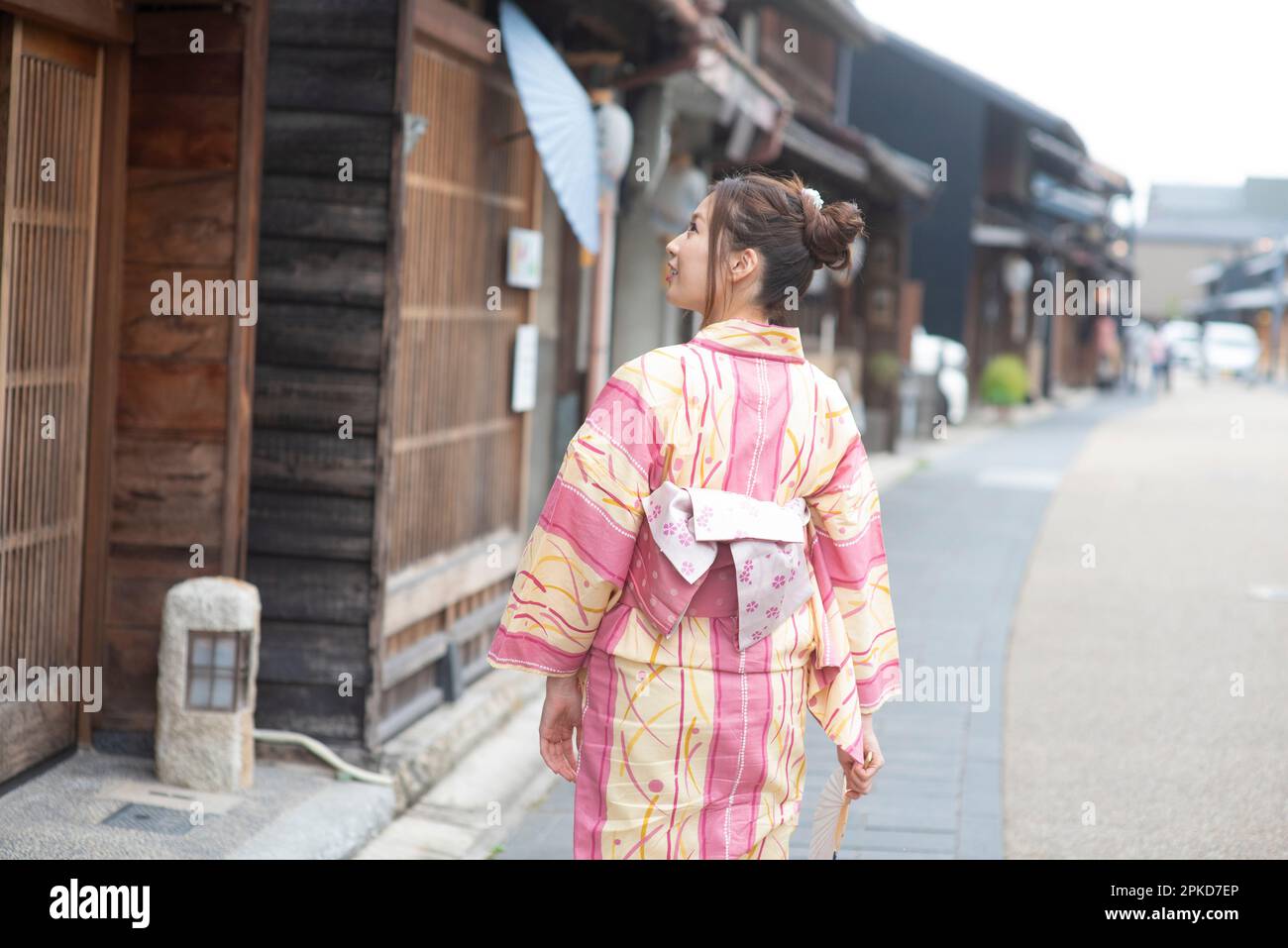 Woman in a yukata strolling in an old private house Stock Photo - Alamy