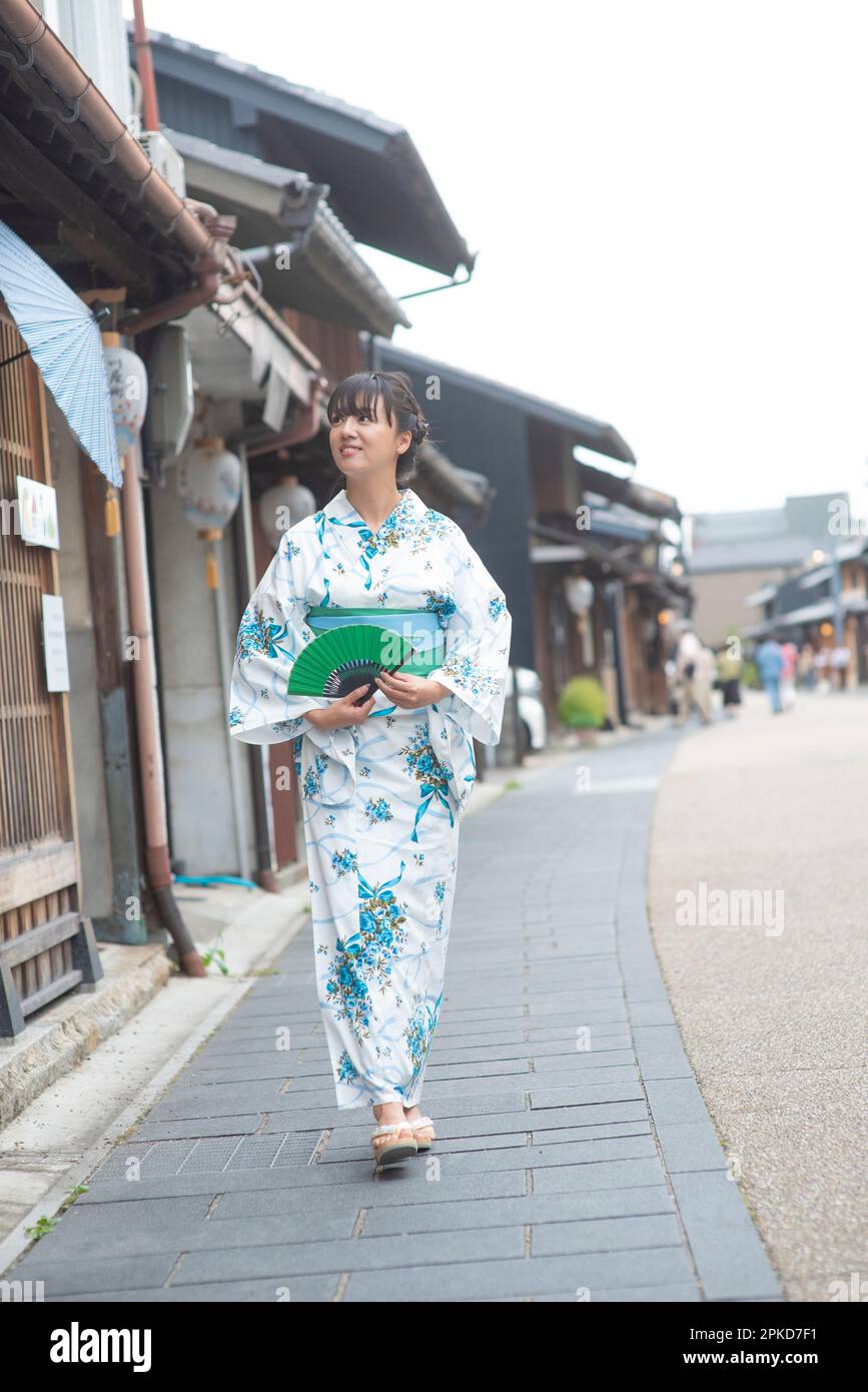 Woman in a yukata strolling in an old private house Stock Photo - Alamy