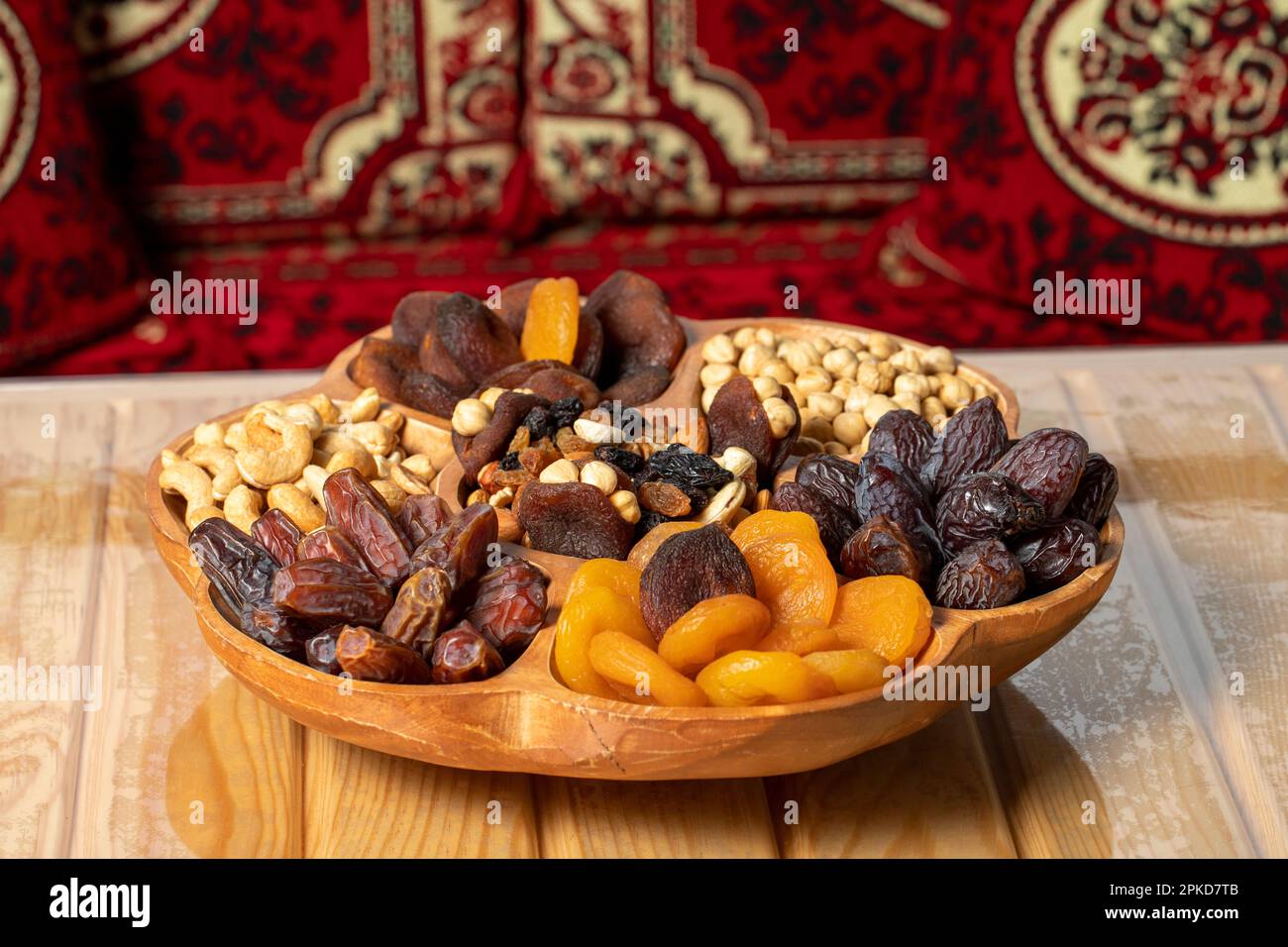 Mixed nuts platter. Wood nut plate prepared with hazelnuts, cashews ...