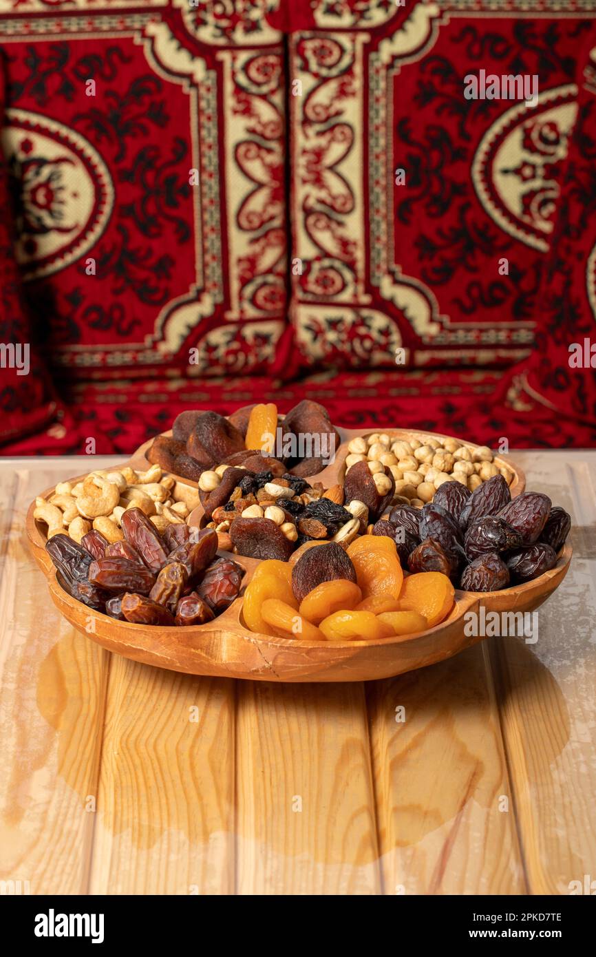 Mixed nuts platter. Wood nut plate prepared with hazelnuts, cashews ...