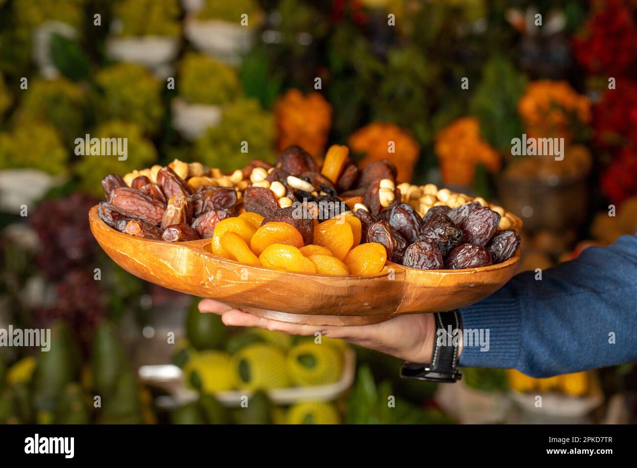 Mixed nuts platter. Wood nut plate prepared with hazelnuts, cashews ...
