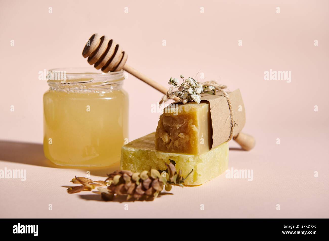 Honey spa concept. Still life. A jar of organic honey and wooden stick ...