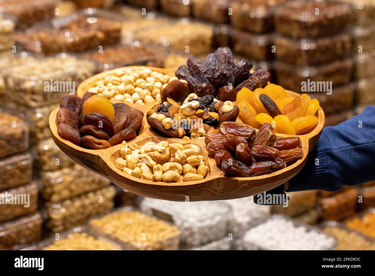 Mixed nuts platter. Wood nut plate prepared with hazelnuts, cashews ...