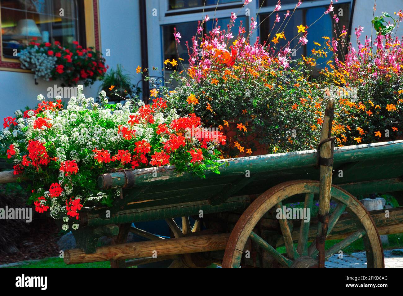 Summer, hay carts, flower arrangements Stock Photo - Alamy