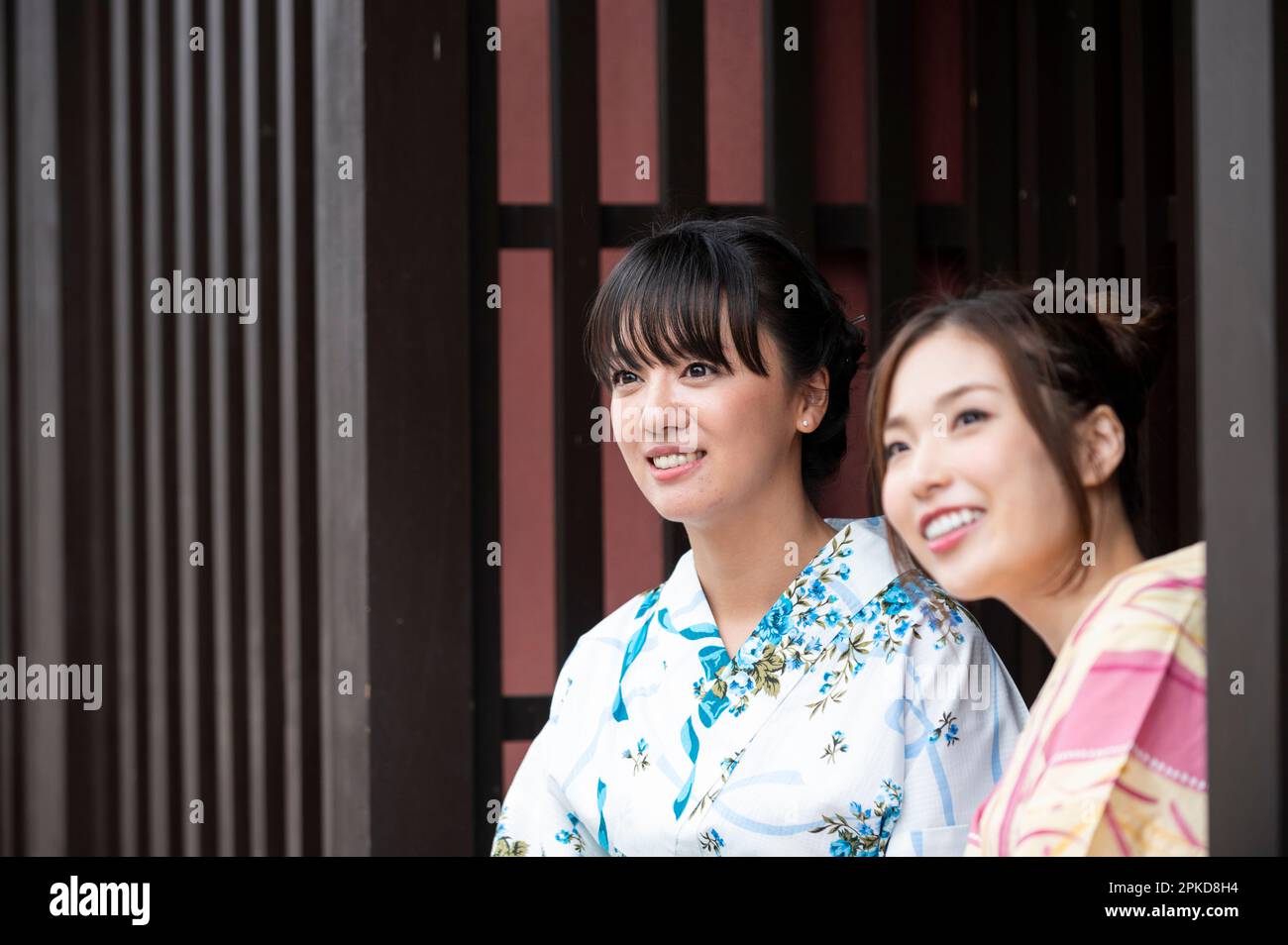 Old house and 2 women in yukata Stock Photo - Alamy