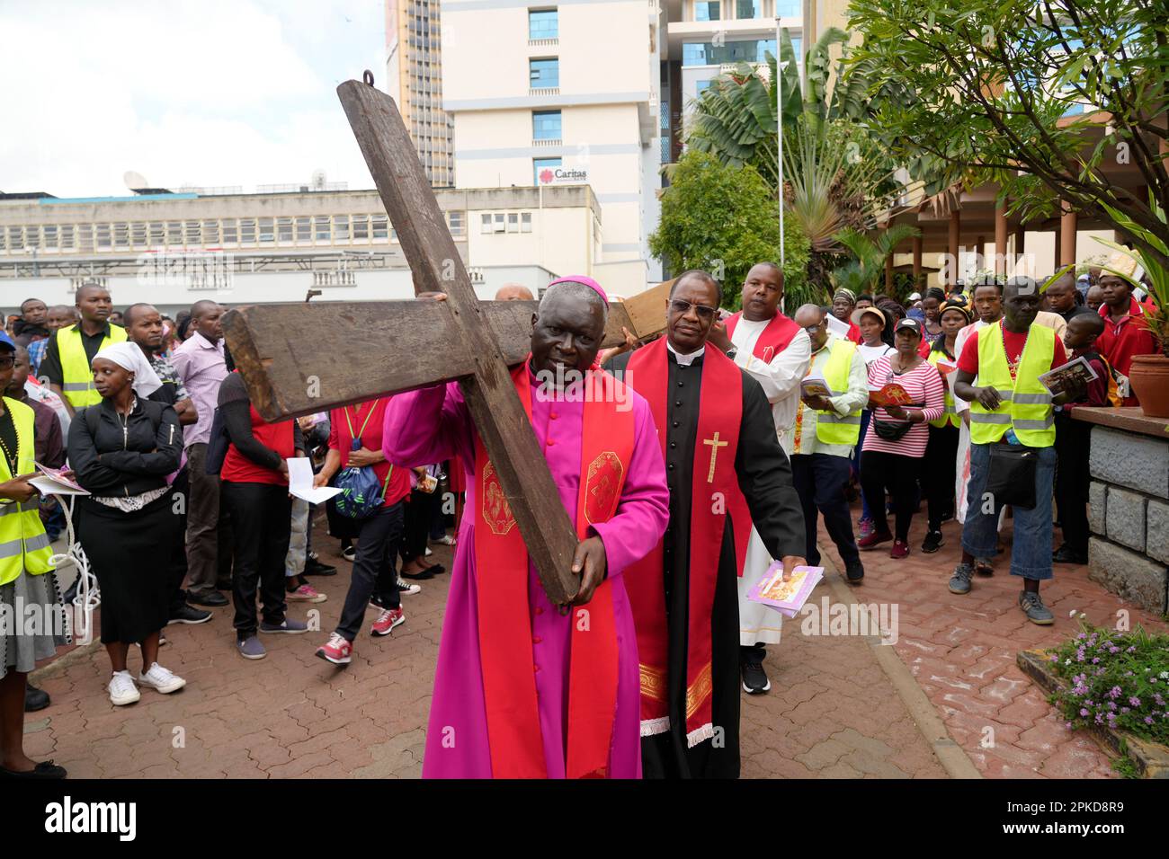 Archbishop of Nairobi Philip Anyolo, carries a wooden cross as he leads ...