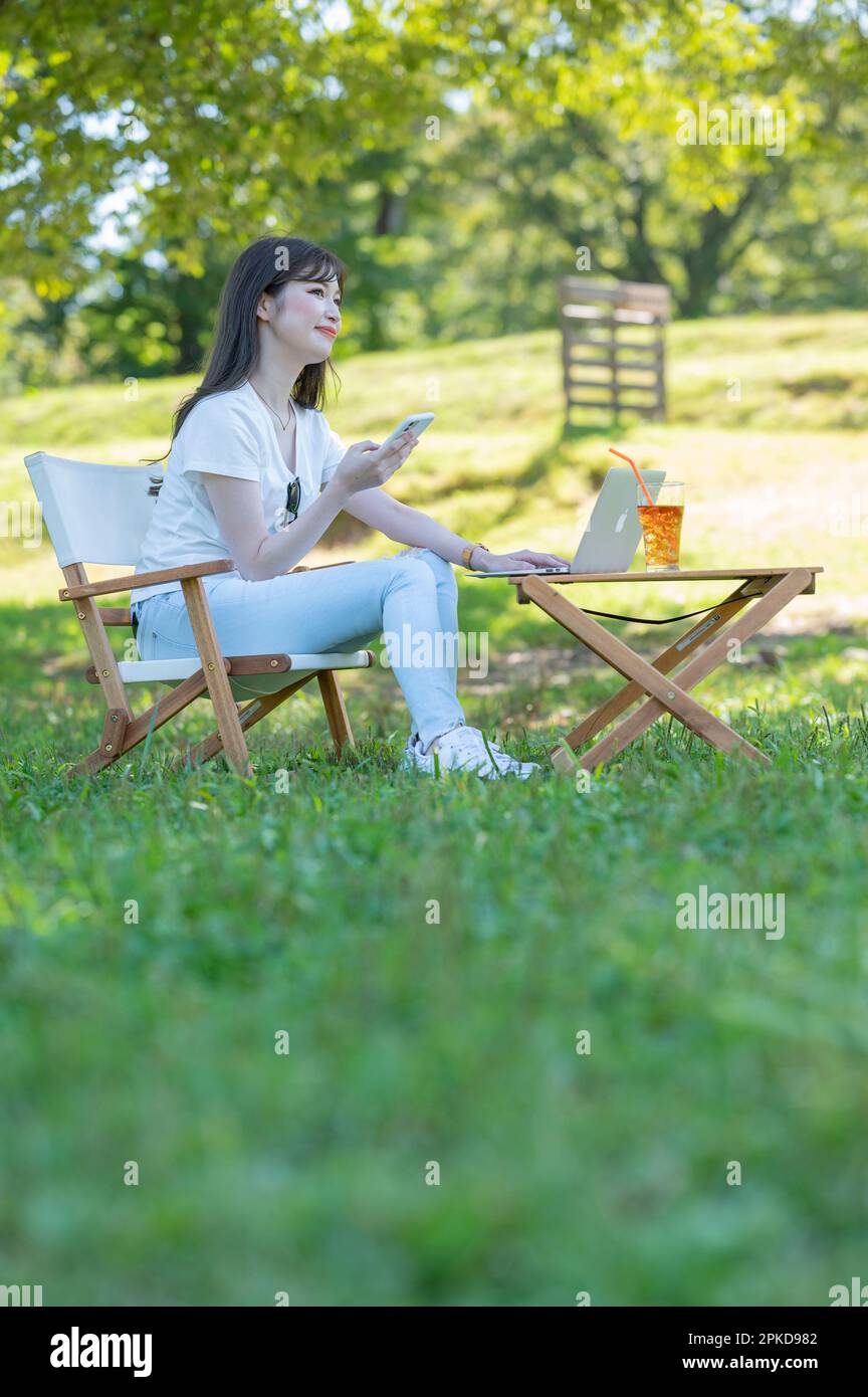 Working remotely with cell phone hi-res stock photography and images ...