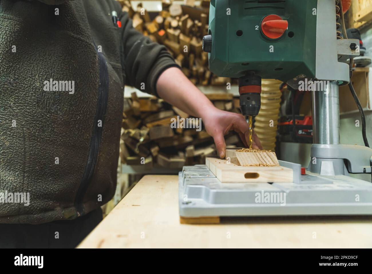 Young man using drill machine hi-res stock photography and images - Alamy
