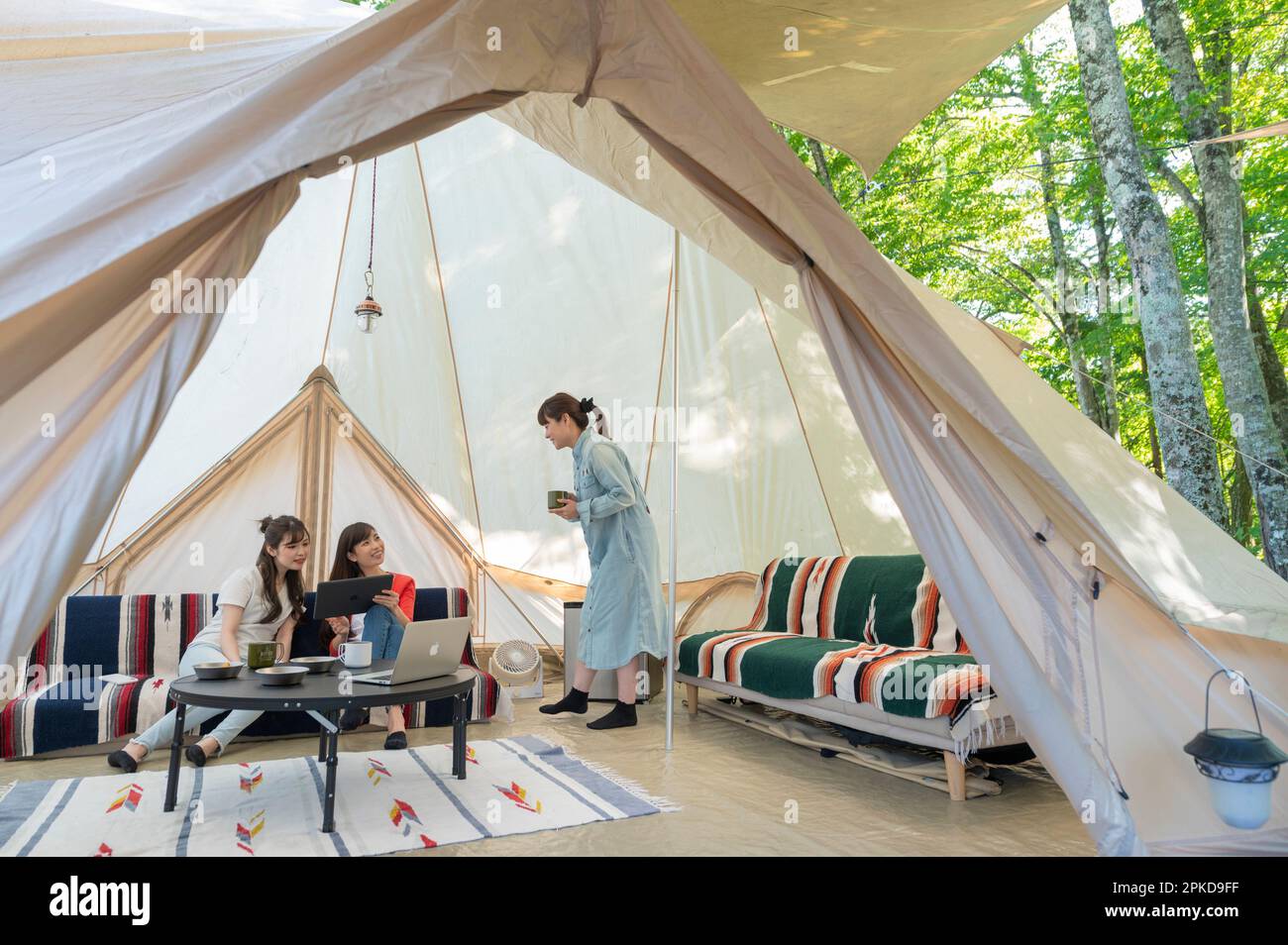 3 women glamping Stock Photo - Alamy