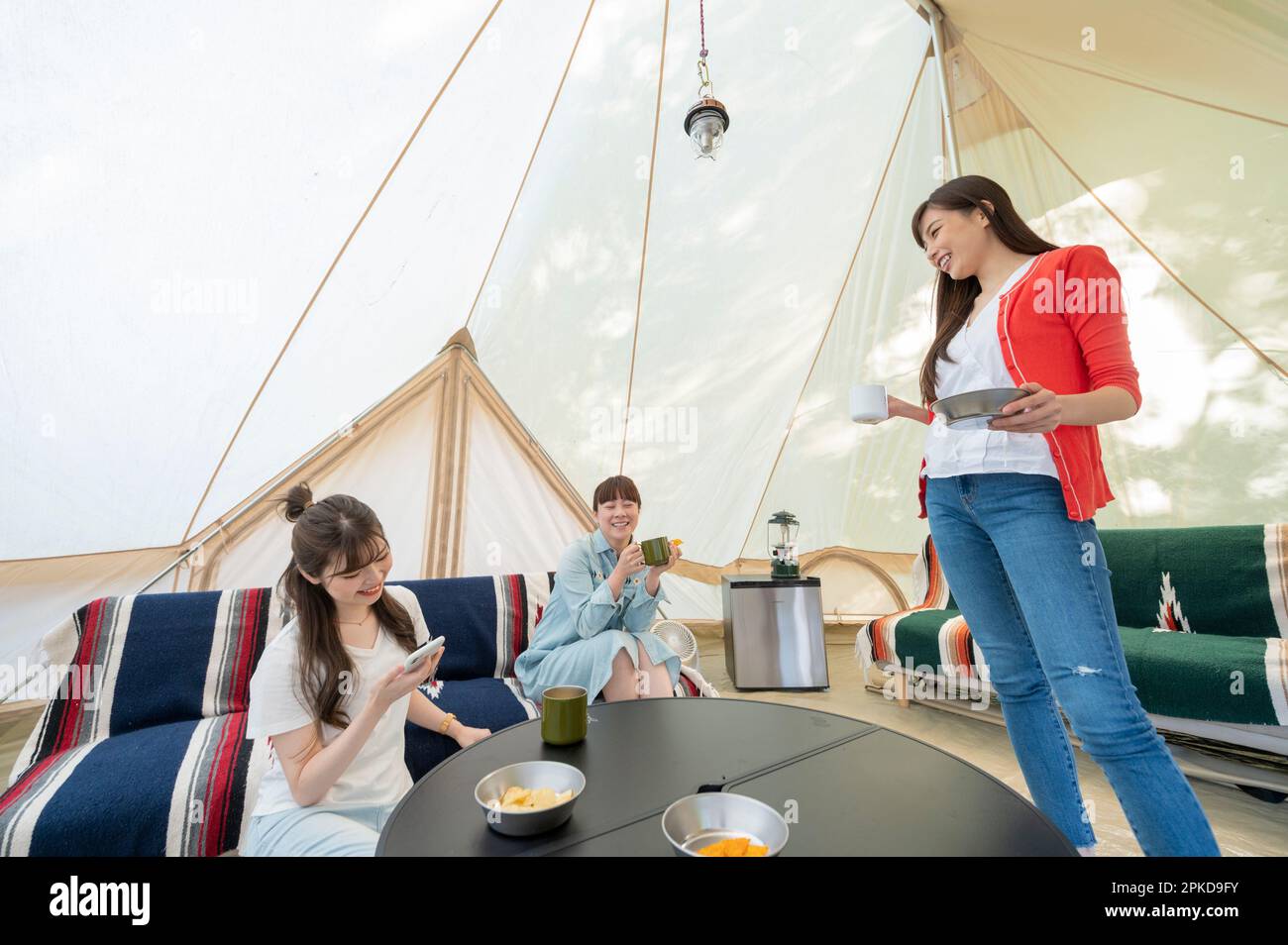 3 women glamping Stock Photo - Alamy
