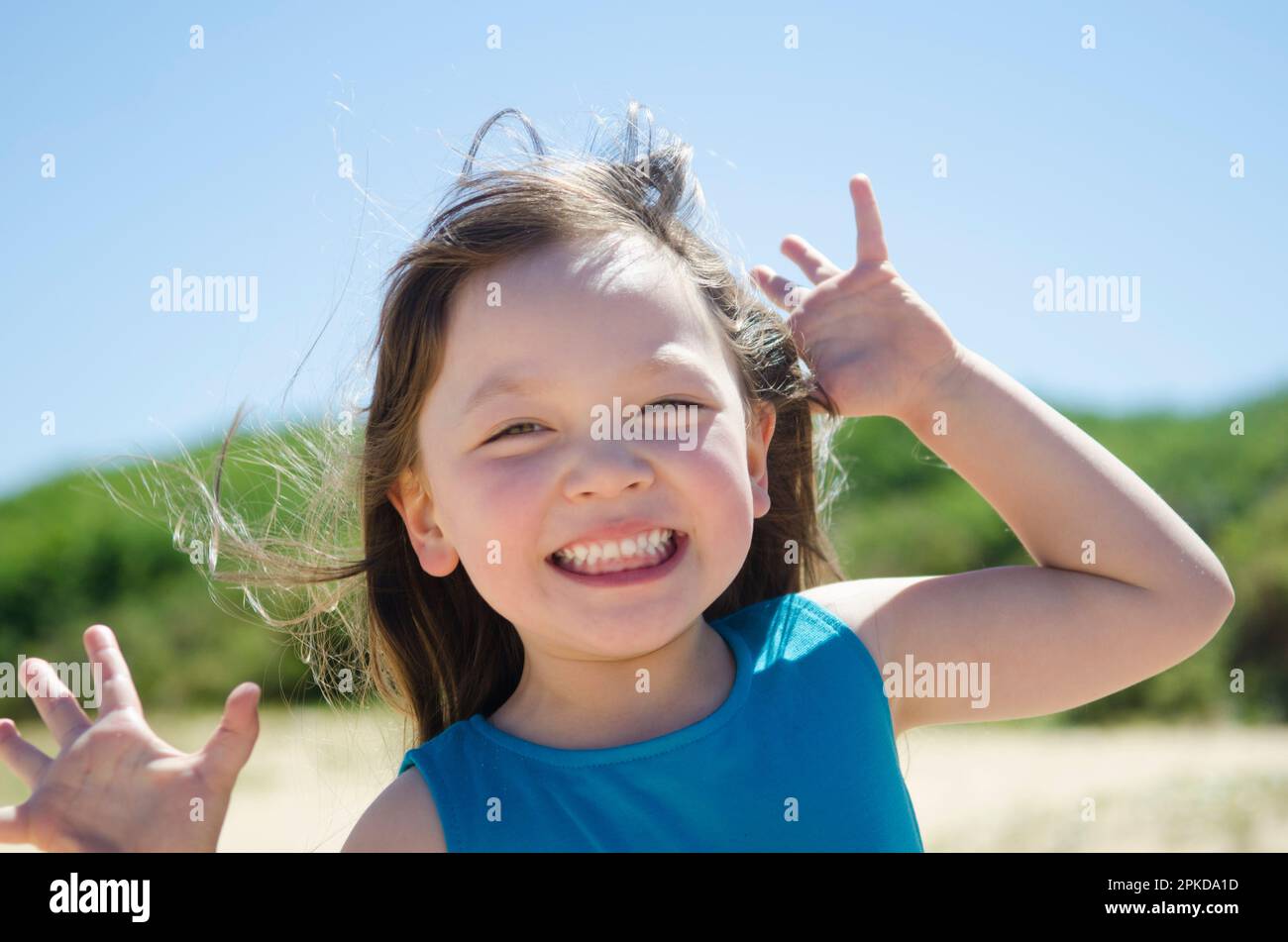 Girl posing and laughing Stock Photo - Alamy