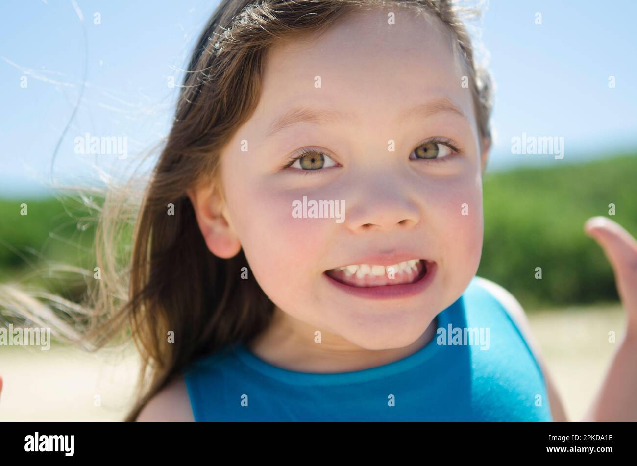 Girl posing and laughing Stock Photo - Alamy