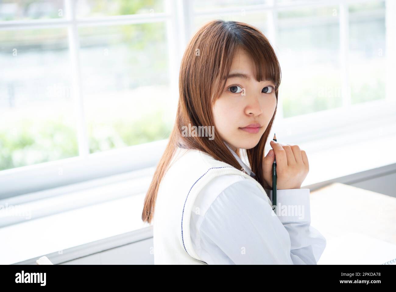 High school girl looking back at the window Stock Photo - Alamy