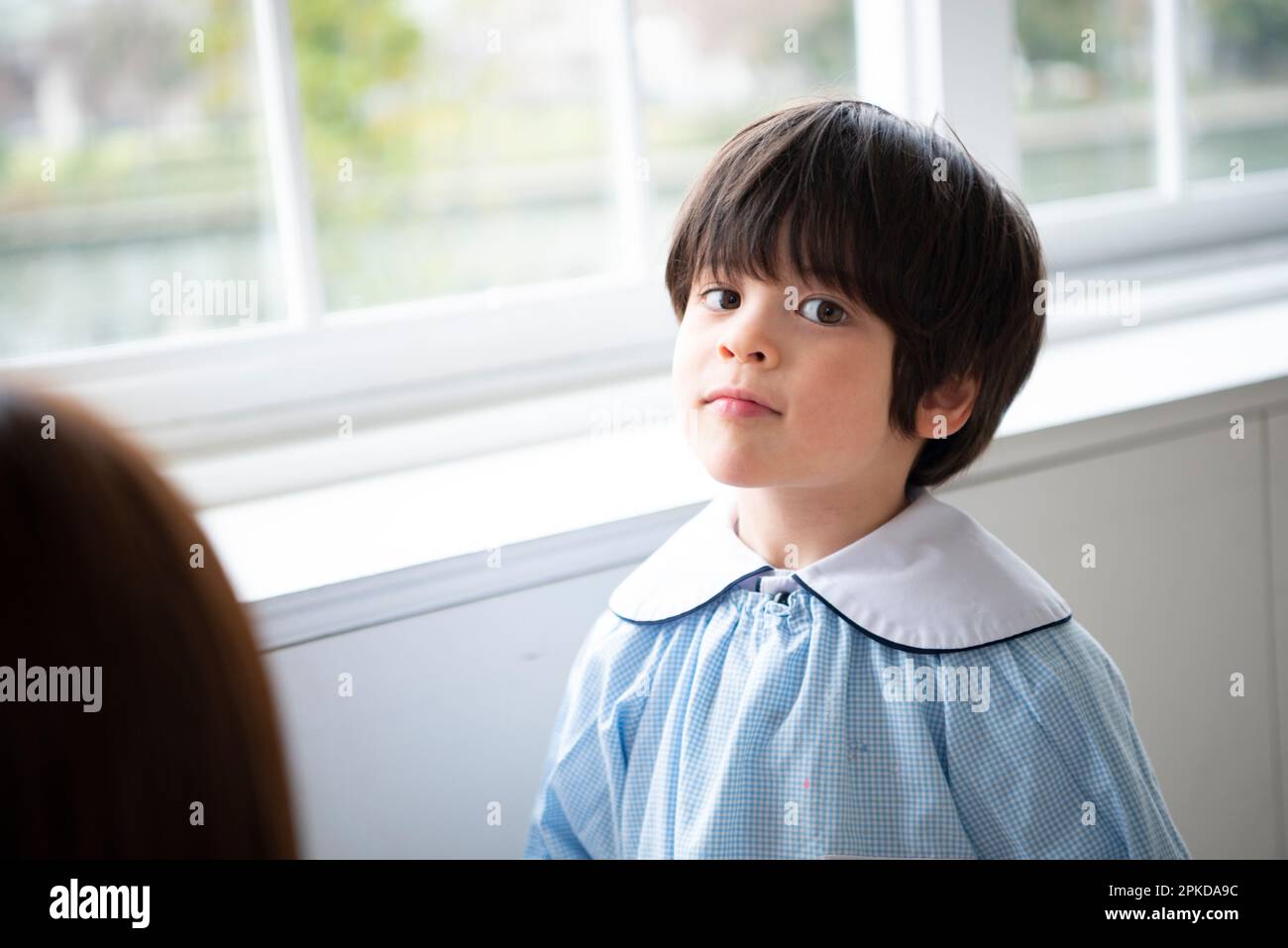 Preschoolers by the window Stock Photo - Alamy