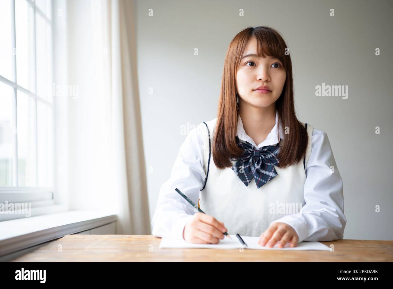Smiling high school girl studying Stock Photo - Alamy