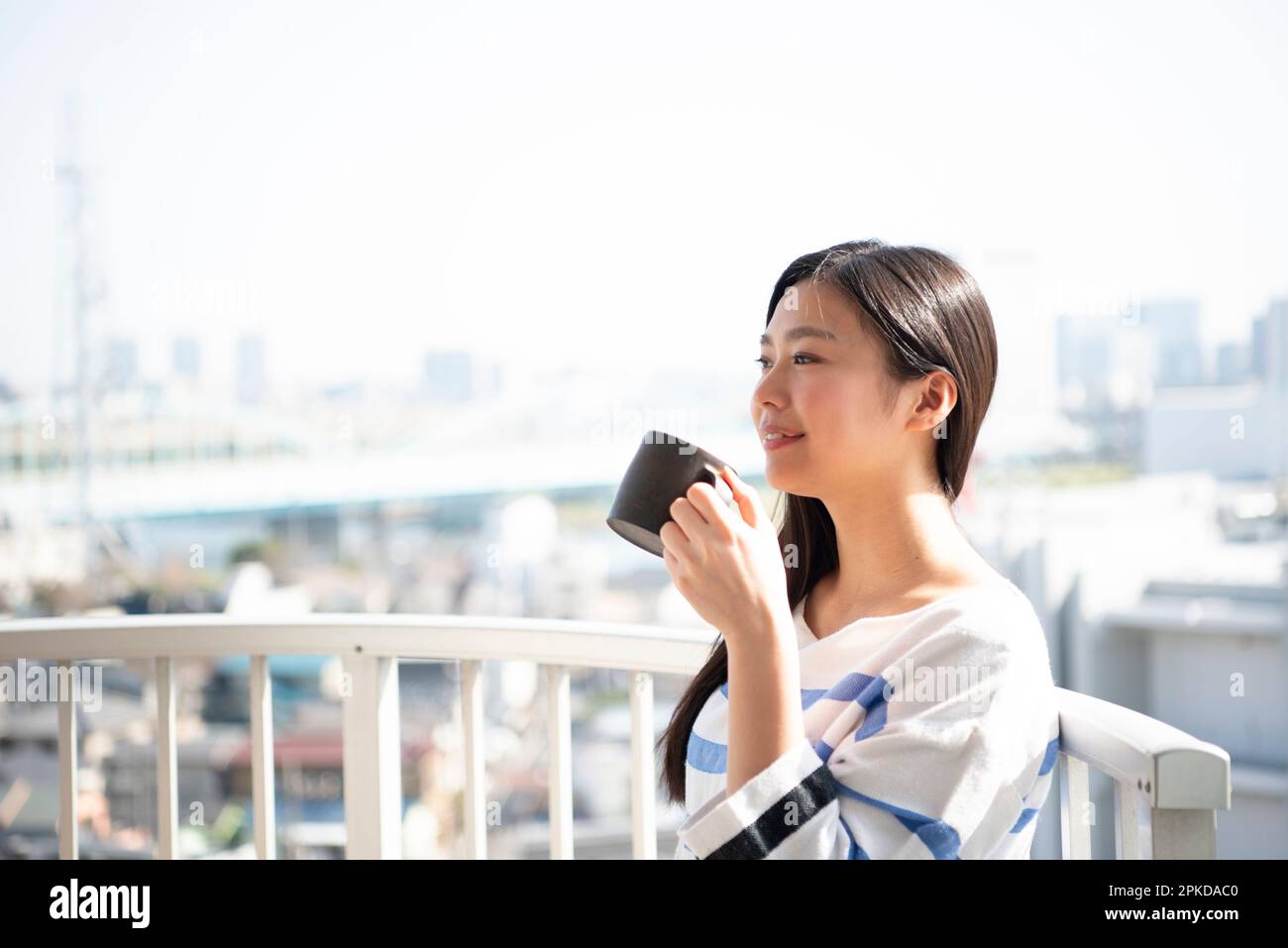 Drinking coffee on the balcony hi-res stock photography and images - Alamy