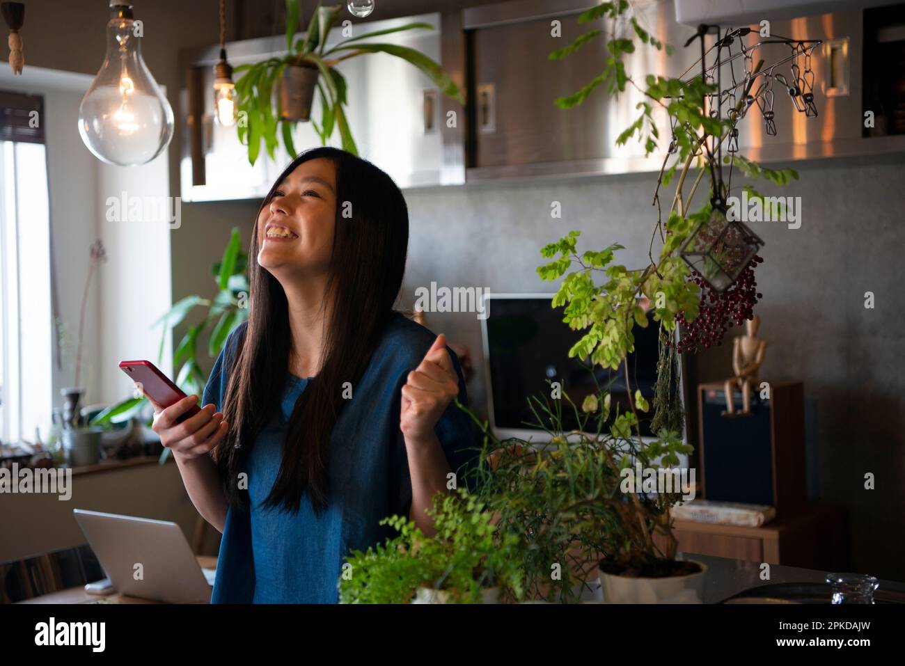 Person and phone at home hi-res stock photography and images - Alamy
