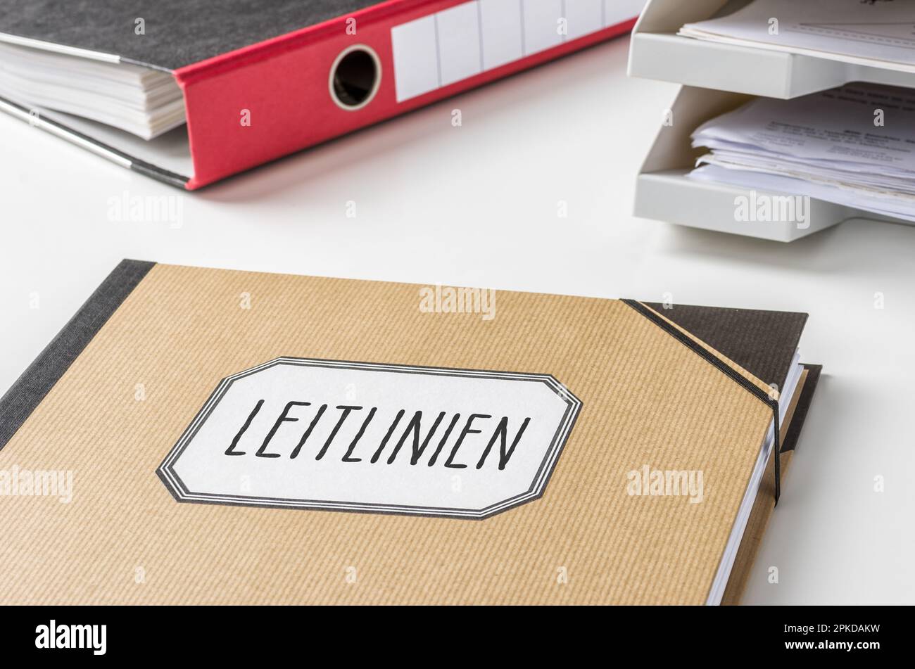 A brown file folder labeled Guidelines in german - Leitlinien Stock ...