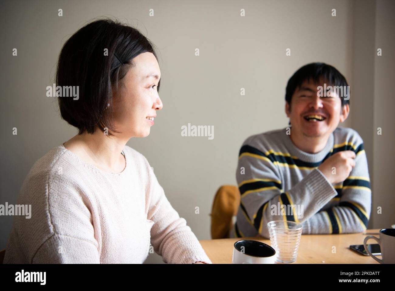 Happy couple at the dining table Stock Photo - Alamy