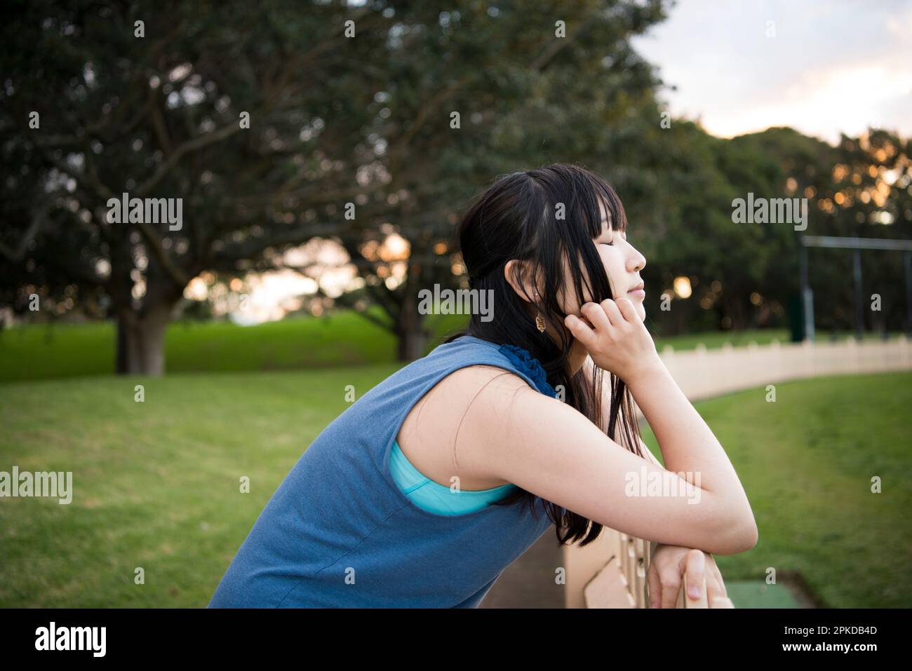 Woman taking a break during exercise Stock Photo - Alamy