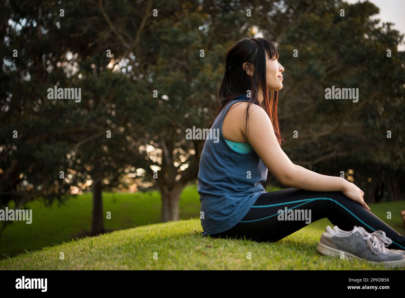 Woman taking a break during exercise Stock Photo - Alamy