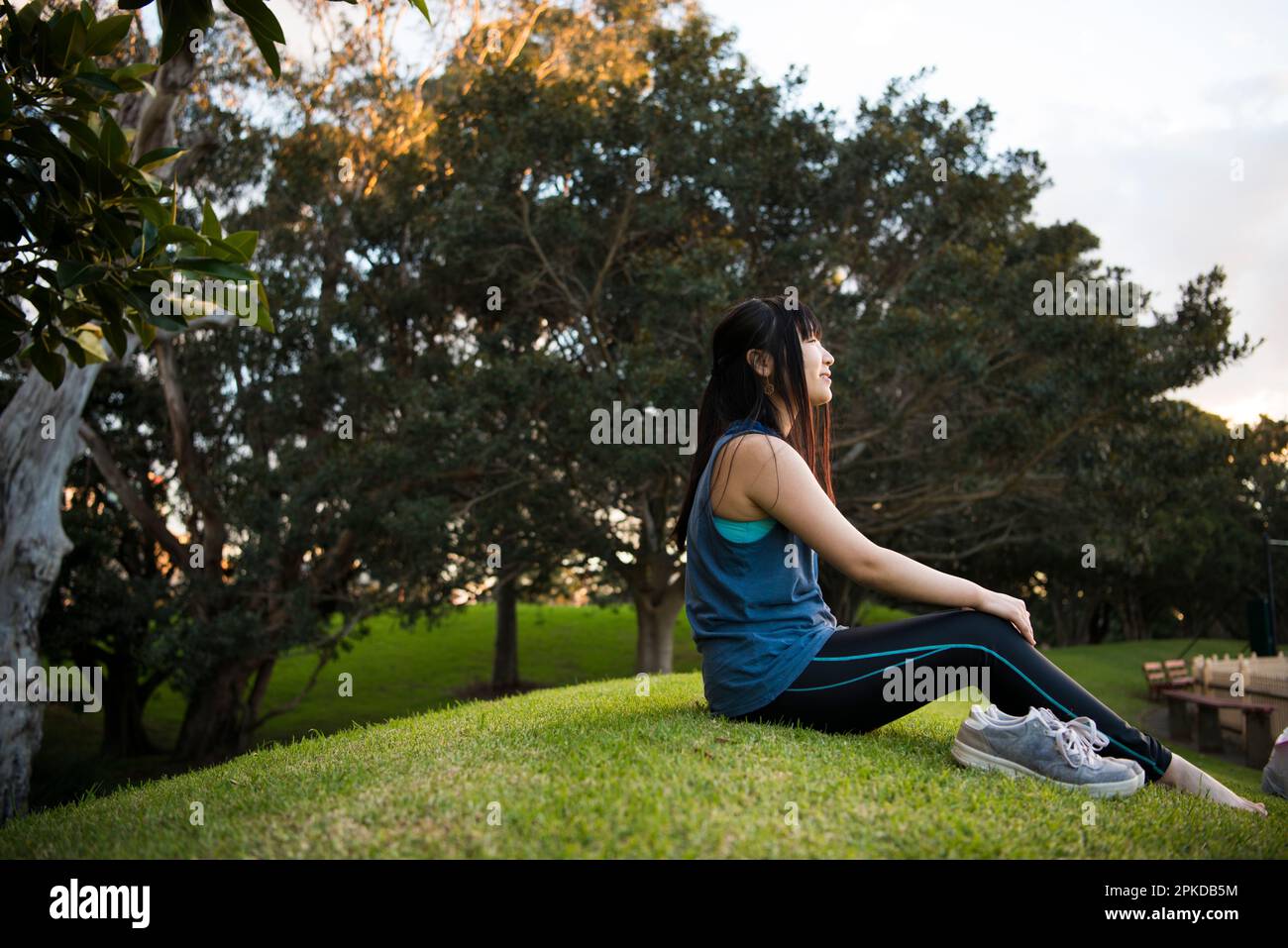 Woman taking a break during exercise Stock Photo - Alamy