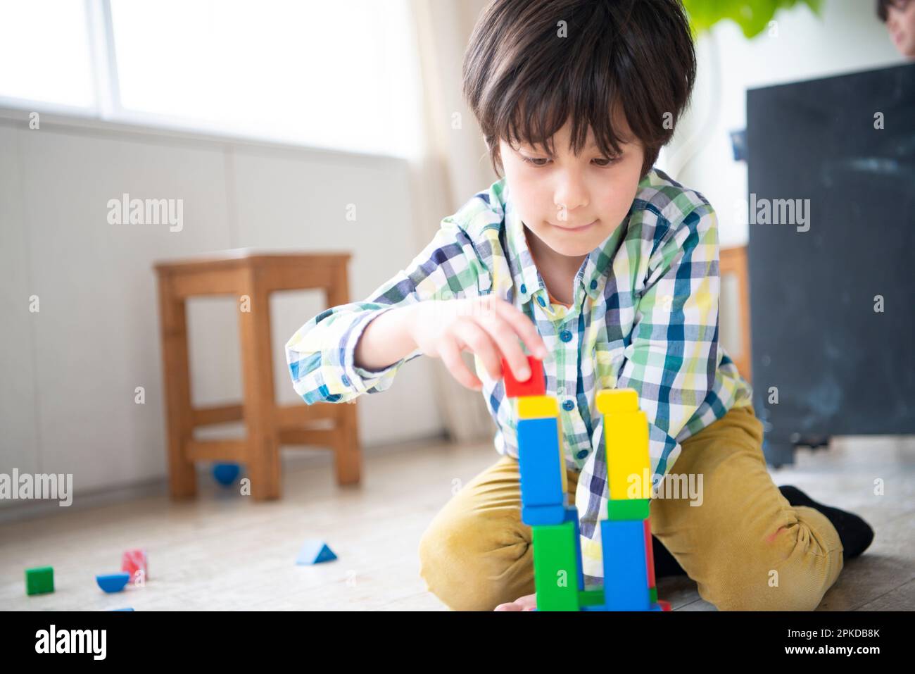Children playing with building blocks Stock Photo - Alamy