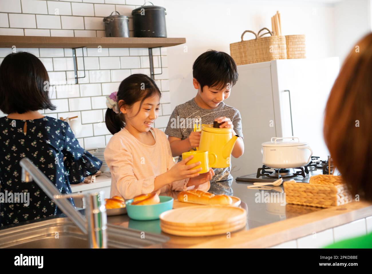 Children laughing in the kitchen Stock Photo - Alamy