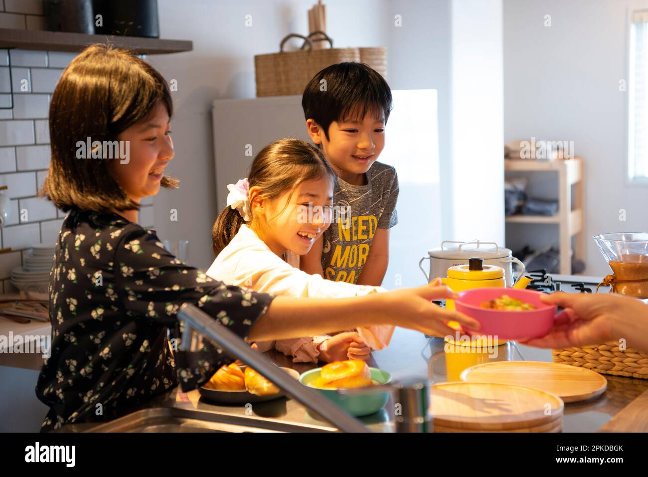 Children laughing in the kitchen Stock Photo - Alamy