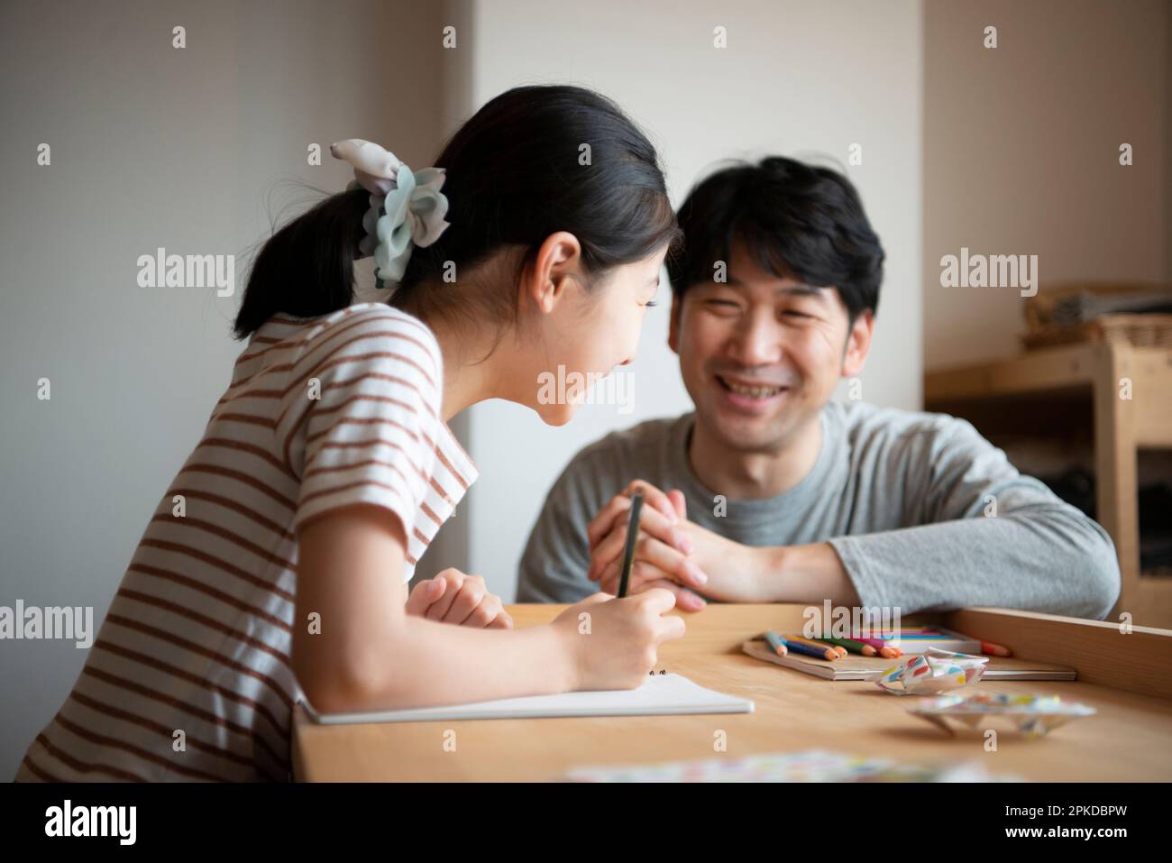 Parent and child laughing at home Stock Photo - Alamy