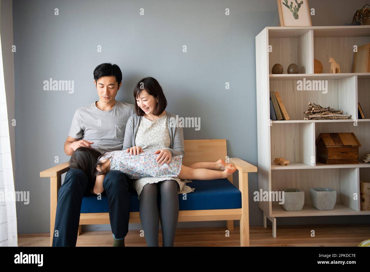 Three people in living room hi-res stock photography and images - Alamy
