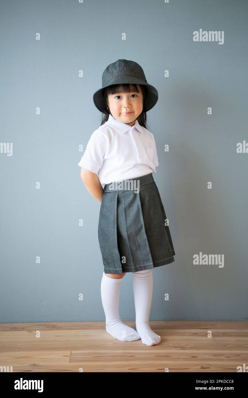 A kindergartner wearing a uniform Stock Photo - Alamy