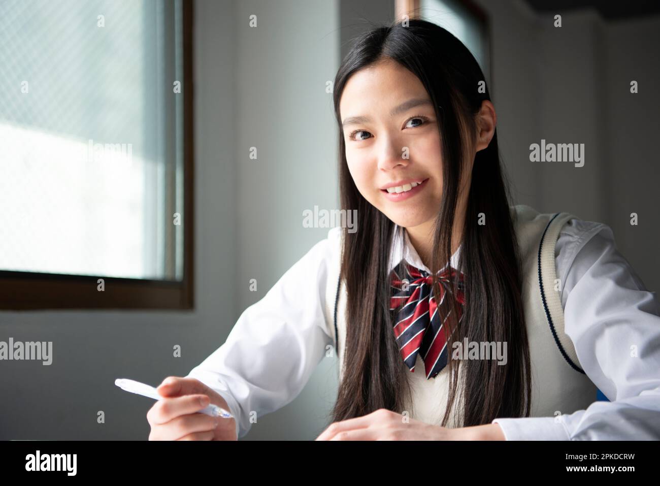 High school girl laughing with a sharp pencil Stock Photo - Alamy