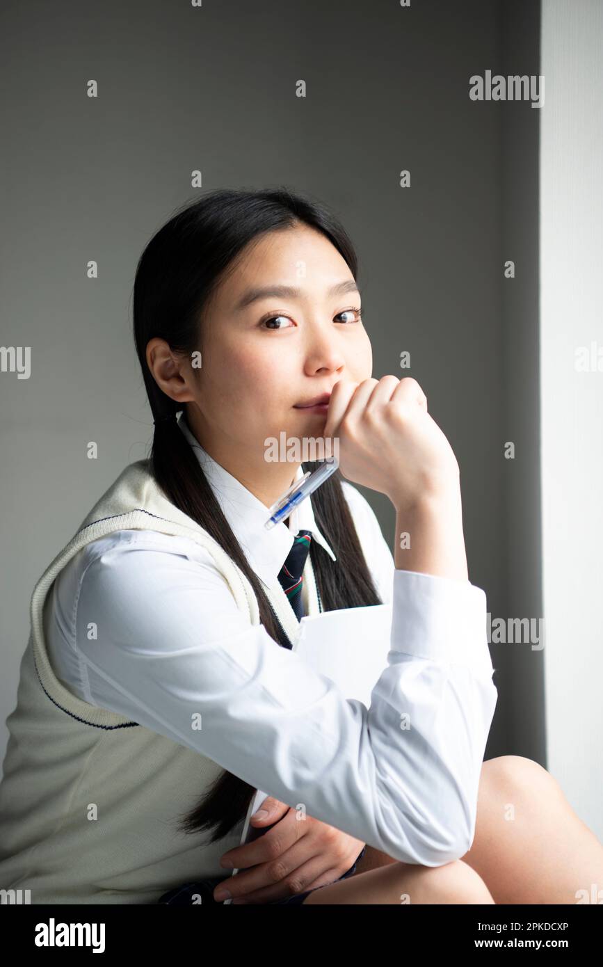 High school girl holding a mechanical pencil Stock Photo - Alamy