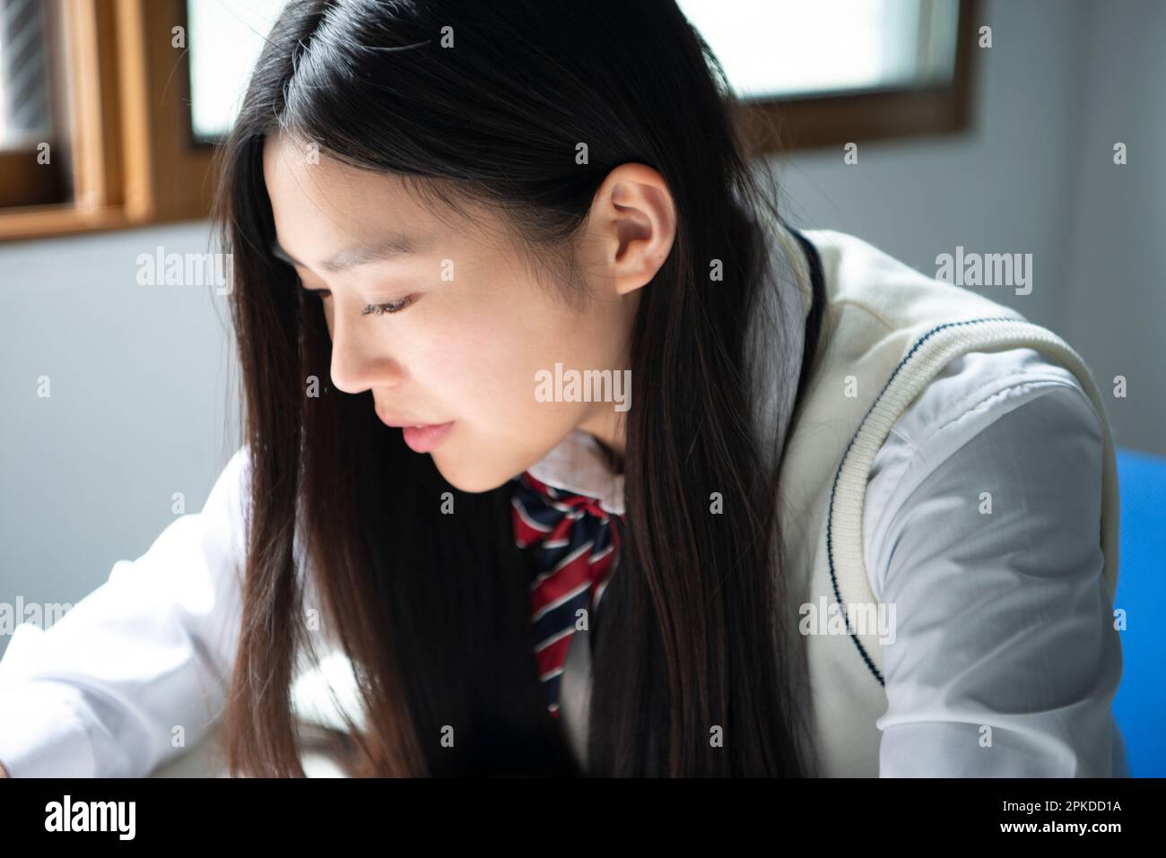 High school girl in profile Stock Photo - Alamy