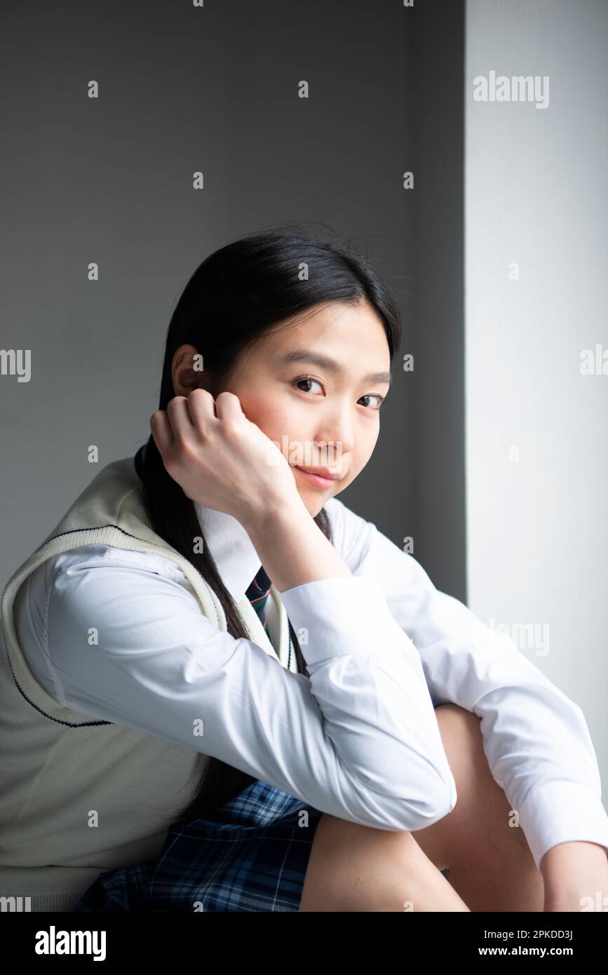 School girl sitting hi-res stock photography and images - Alamy