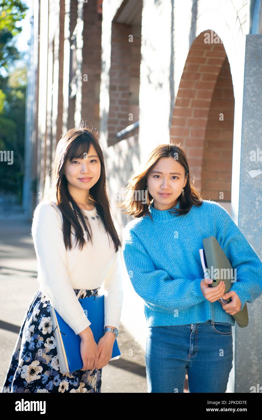 2 people holding files Stock Photo - Alamy