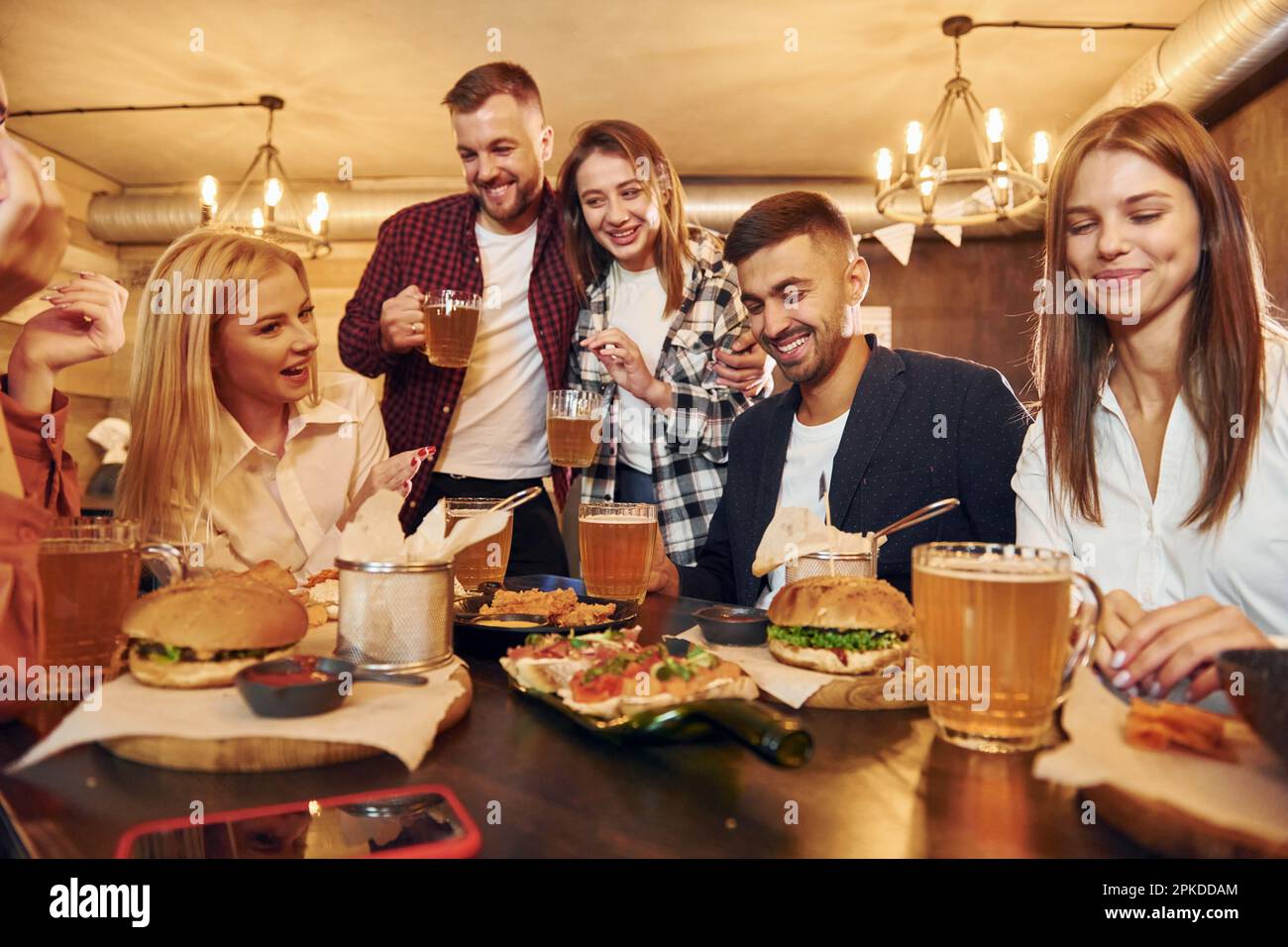 Young friends. Group people sitting together in bar with beer Stock ...